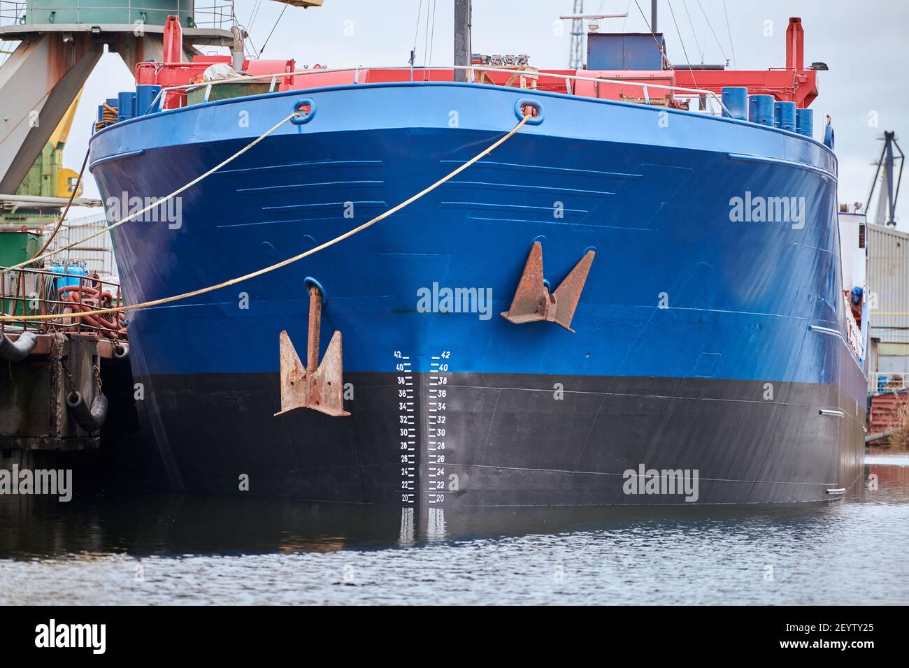 Front view of moored large cargo ship. Freighter in shipyard. Seaport ...