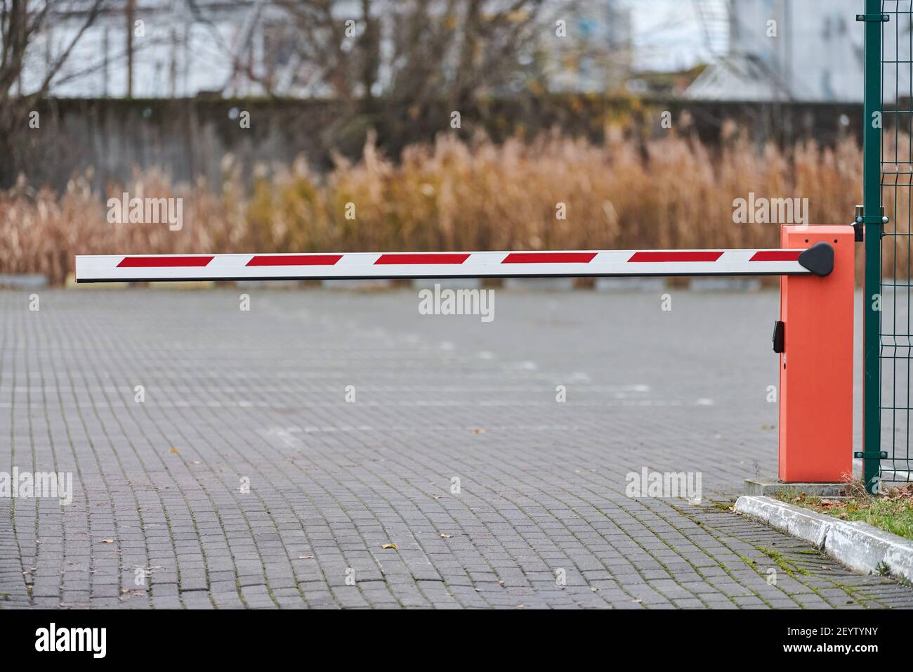 Parking gate, automatic car barrier system for car-park security. White ...