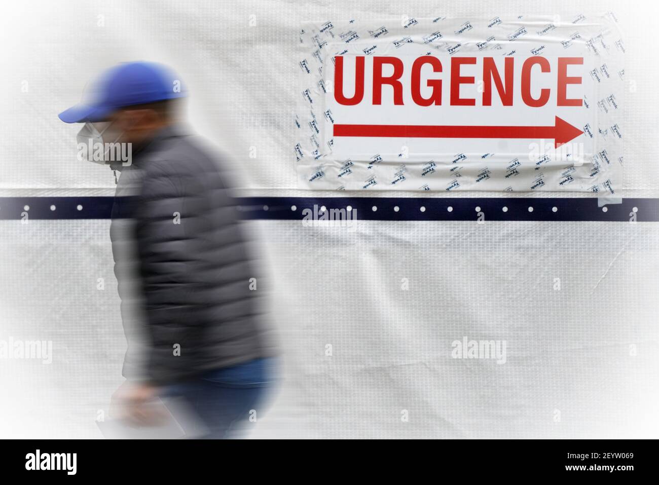 Montreal,Quebec,Canada,January 13,2021.Man with hospital emergency sign ...