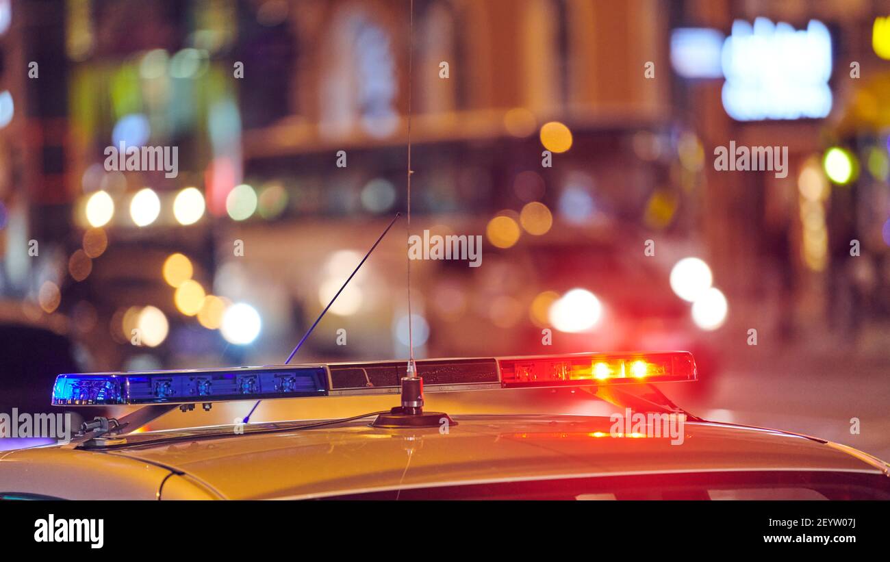 Police car lights at night city street. Red and blue lights. Road ...