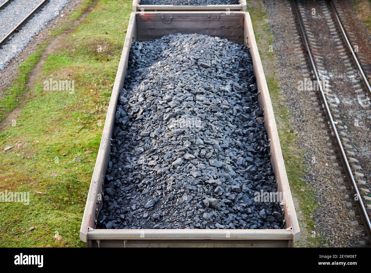 Railway cargo cars loaded with coal. Freight train transporting coal ...