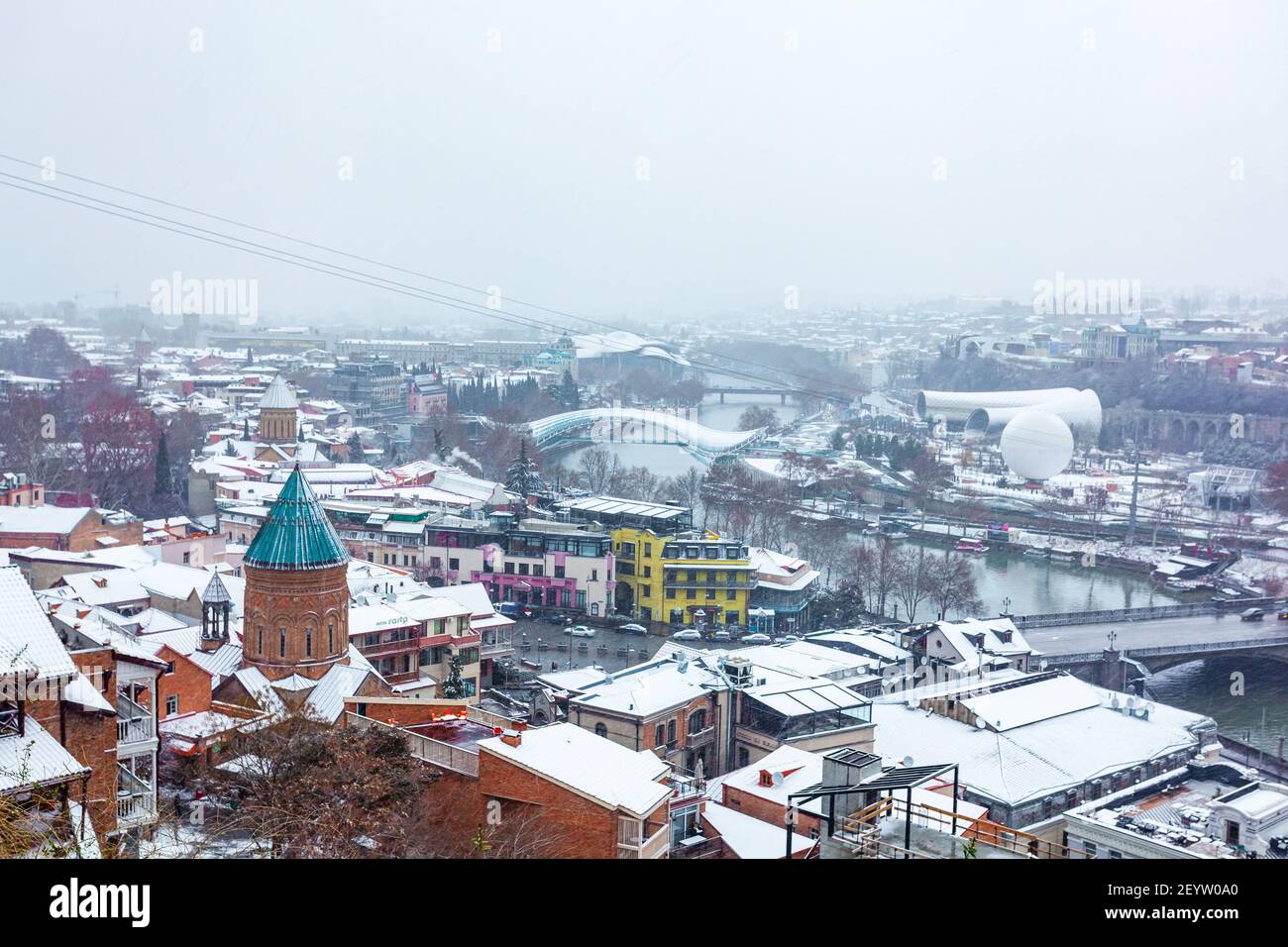 Tbilisi, Georgia - 24 February, 2021: Old Tbilisis with covered snow ...