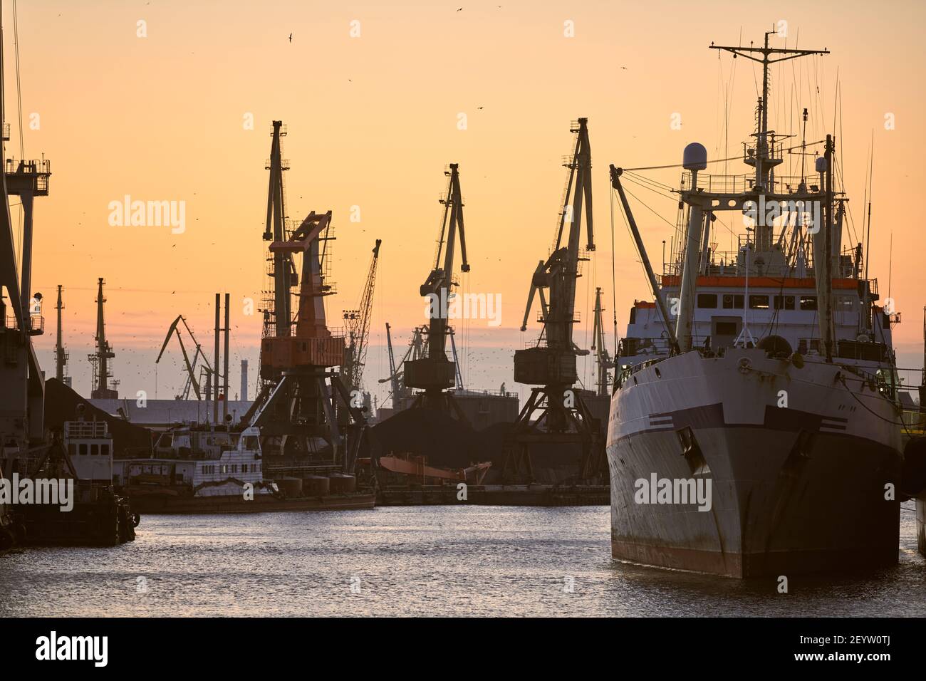 Ships in sea port on sunset background. Scenery industrial landscape ...