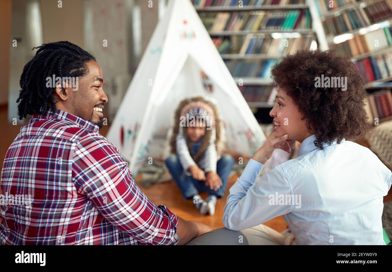 Young spouses enjoying quality time in a family atmosphere at home with ...