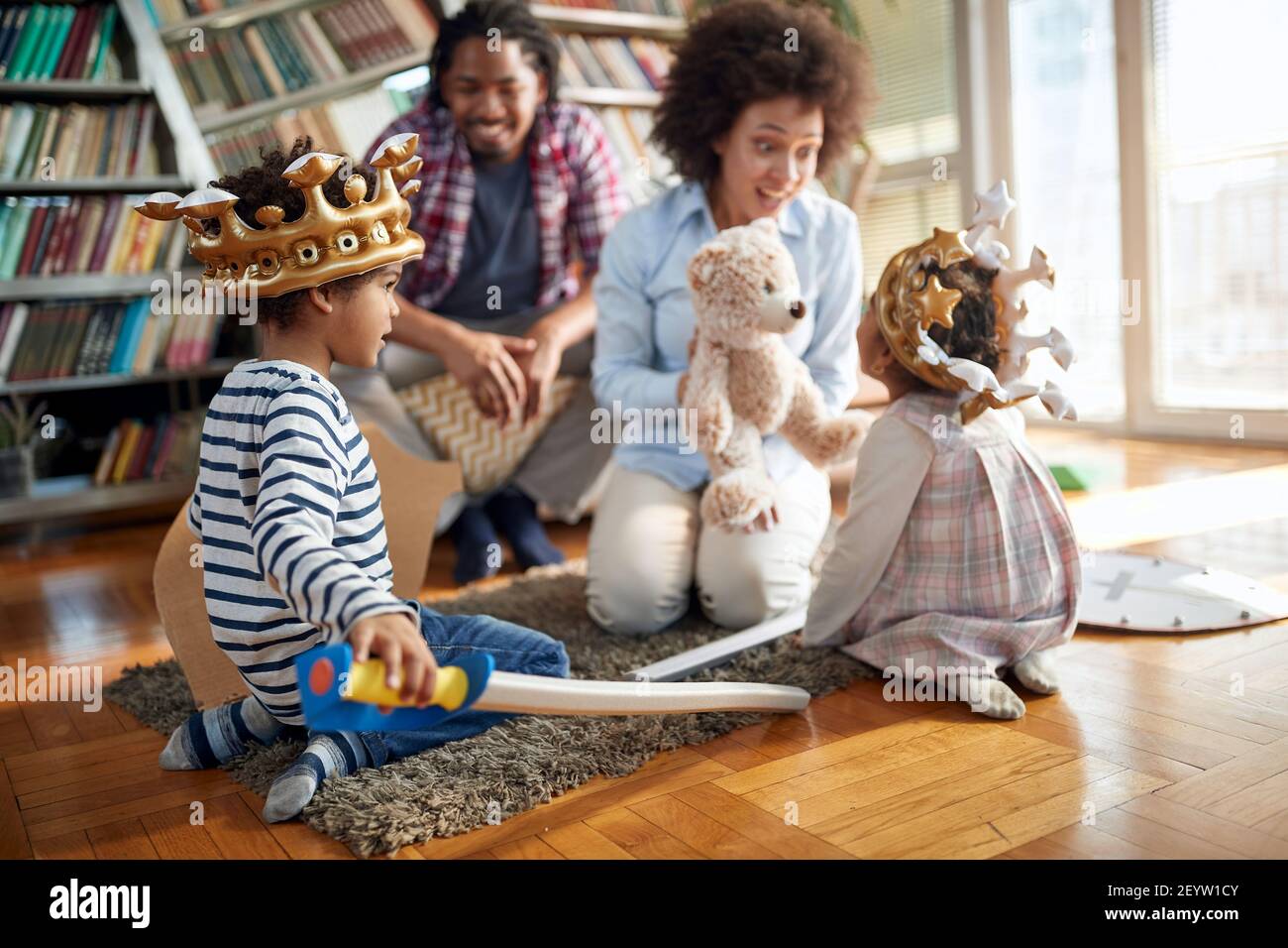 Young parents have a wonderful time with kids in a family atmosphere at ...