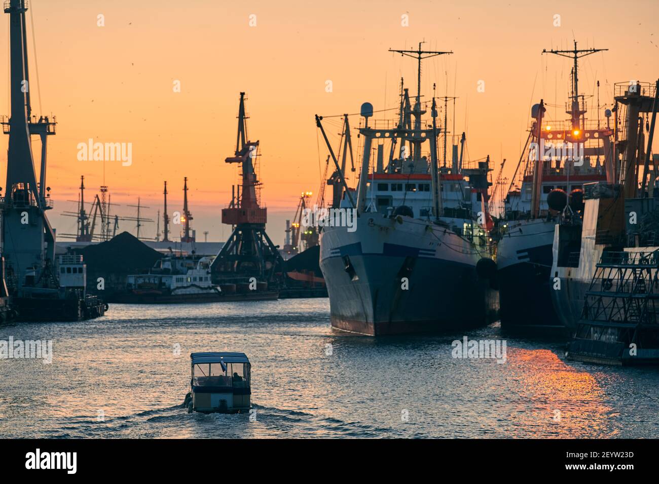 Ships in sea port on sunset background. Scenery industrial landscape ...