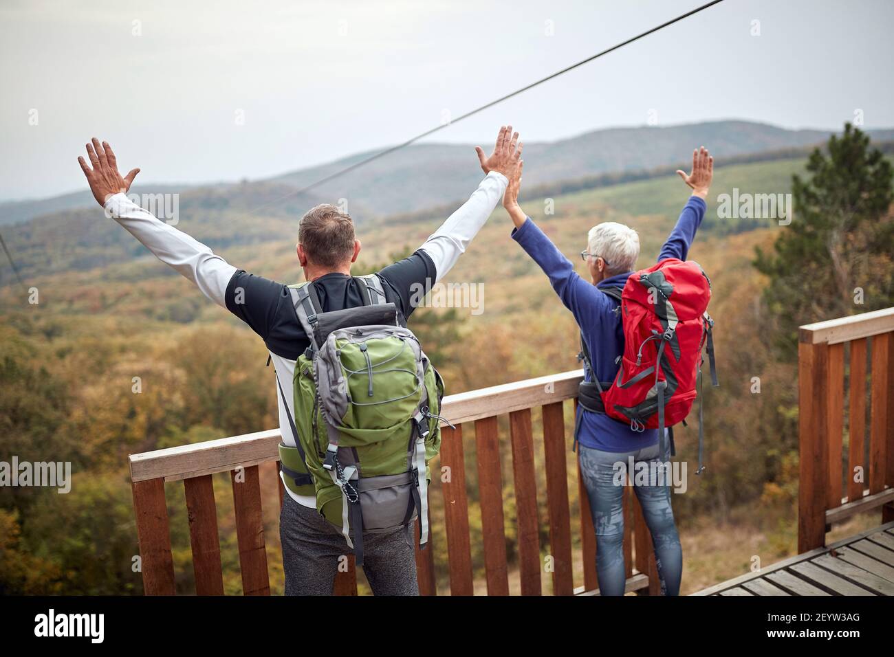 Back view couple walking arms hi-res stock photography and images - Alamy