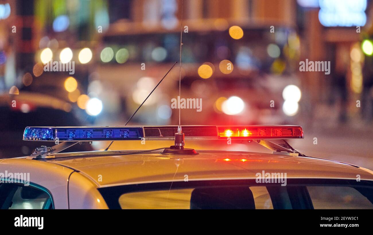 Police car lights at night city street. Red and blue lights. Road ...