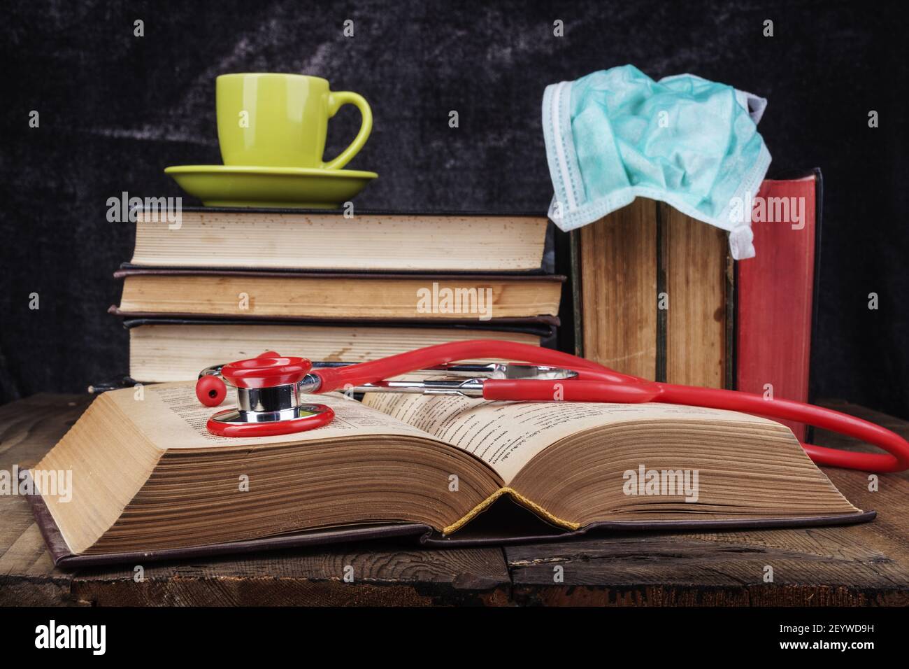 Green Coffee on Books Stock Photo - Alamy