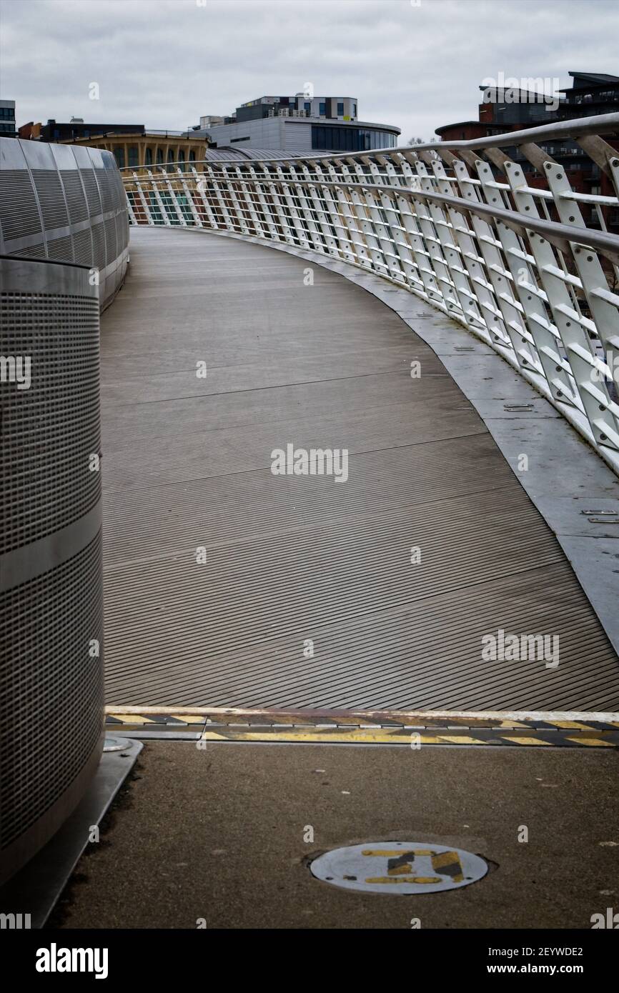 The footpath and barriers of the Gateshead Millennium Bridge in North ...