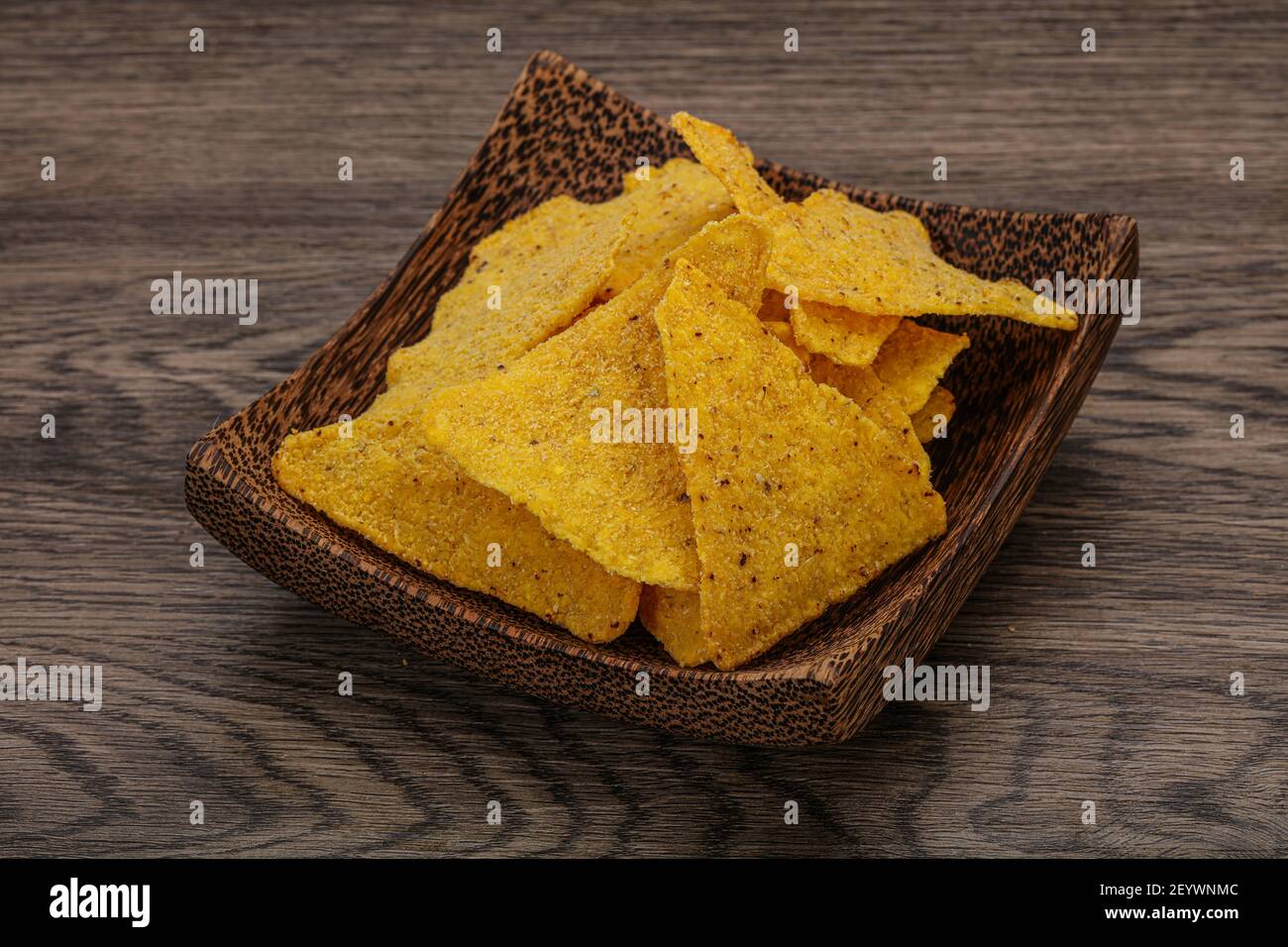Mexican crunchy corn nachos triangle heap Stock Photo - Alamy