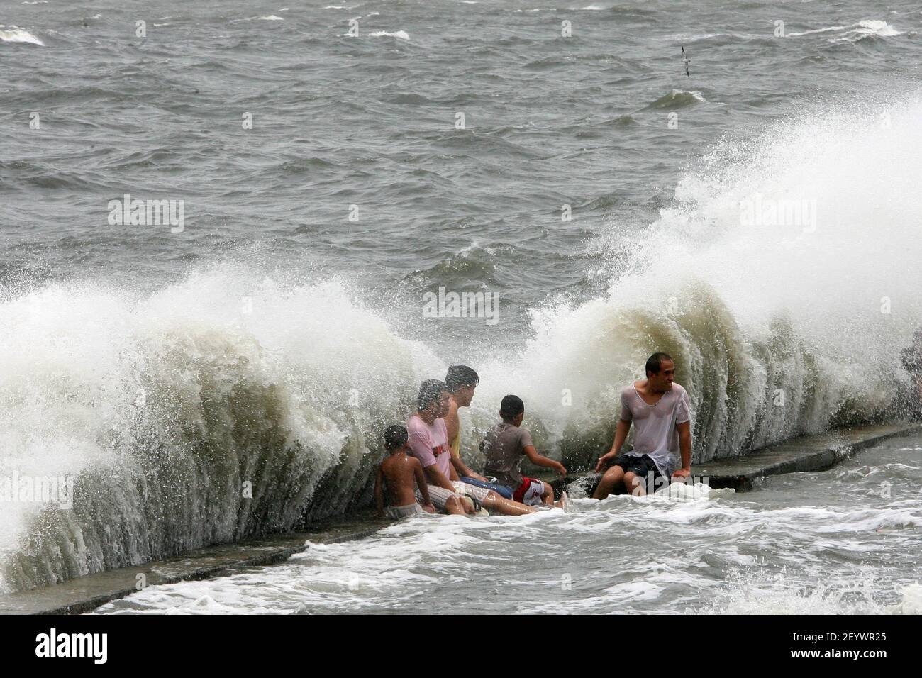 01 August 2012 - Manila, China - Residents frolic in the huge waves ...