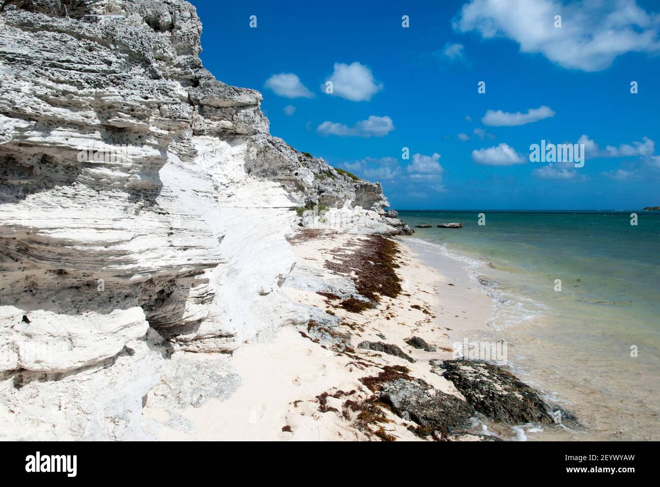 The shore between eroded rocks and the sea during the low tide on Grand ...