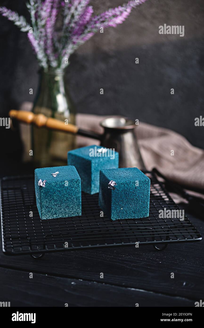 Blue cake filled with orange and tangerine in the shape of a cube ...