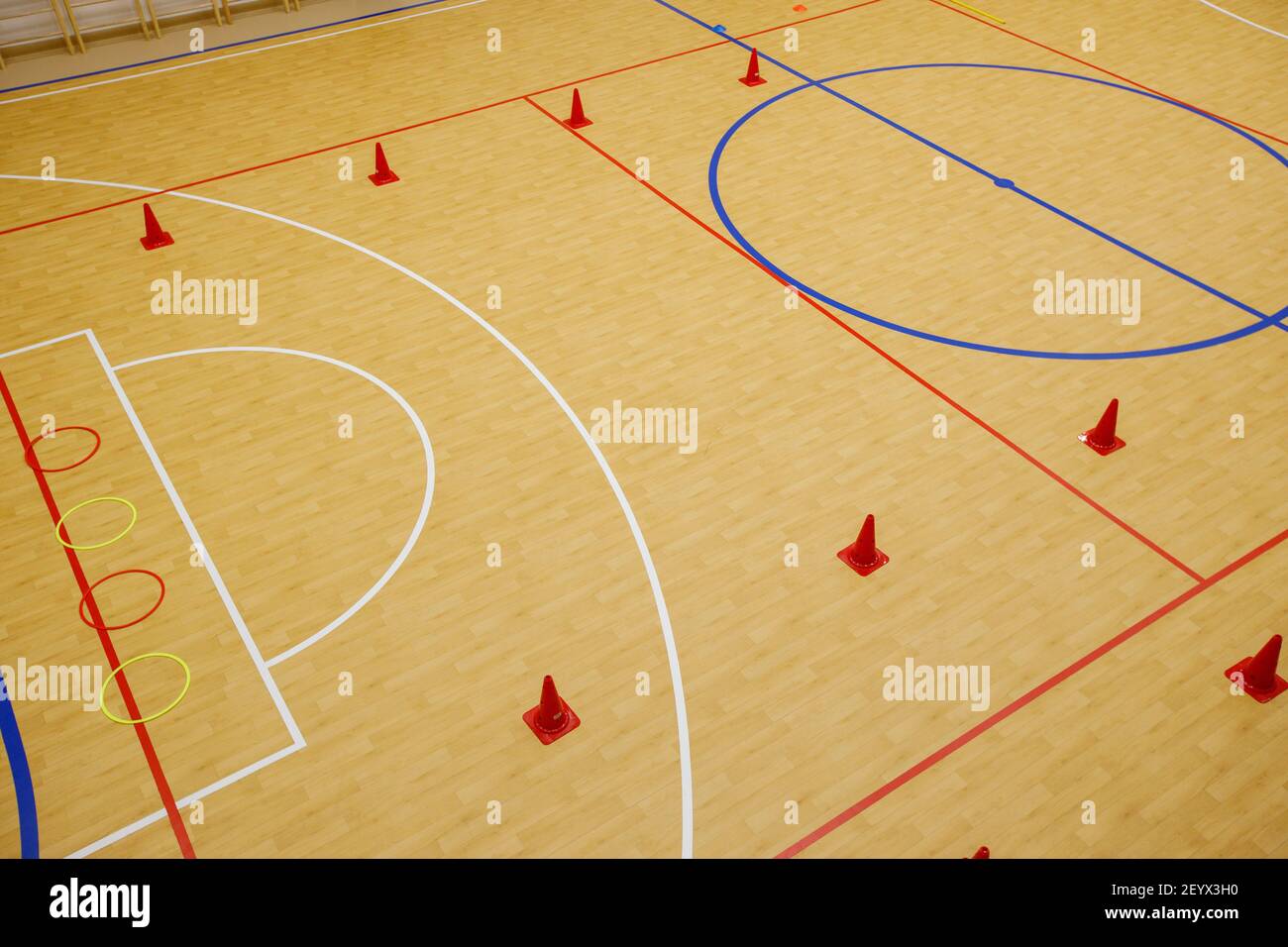 Gym for playing futsal, mini-football. Folded wooden parquet on the ...