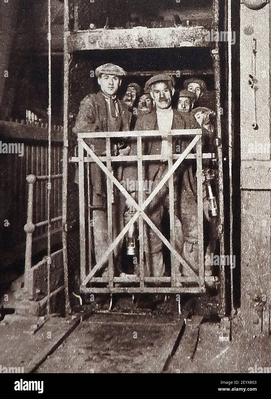 An old photograph (circa 1940's) showing British miners in a pit cage ...