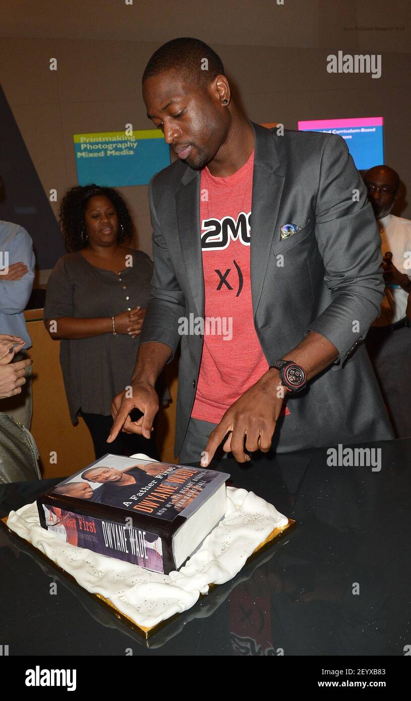 7 September 2012 - Fort Lauderdale, Florida - Dwyane Wade signs copies ...