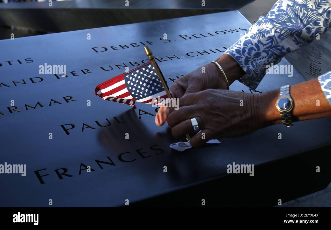 11 September 2012 - New York, NY - Judy Parisio places an American flag ...