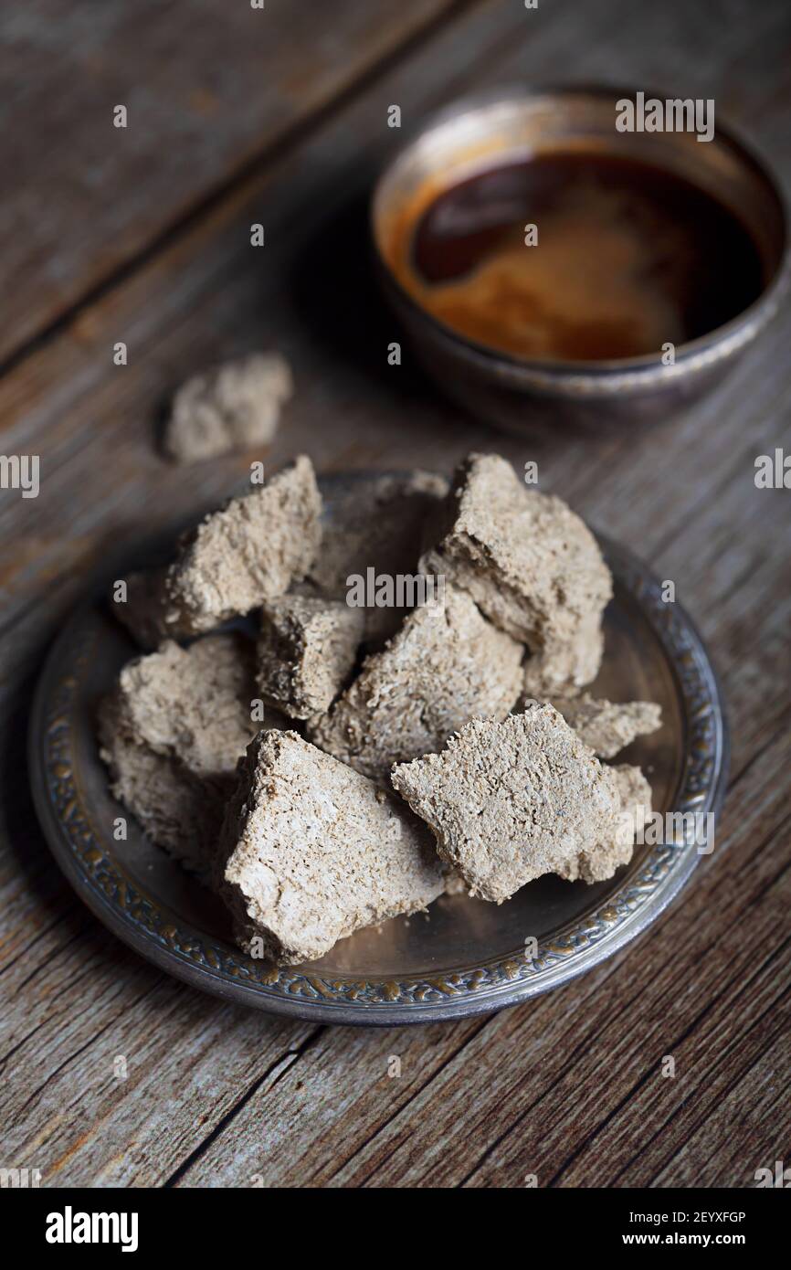 Vegetable-based halva sweet prepared from seeds and cup of coffee on ...