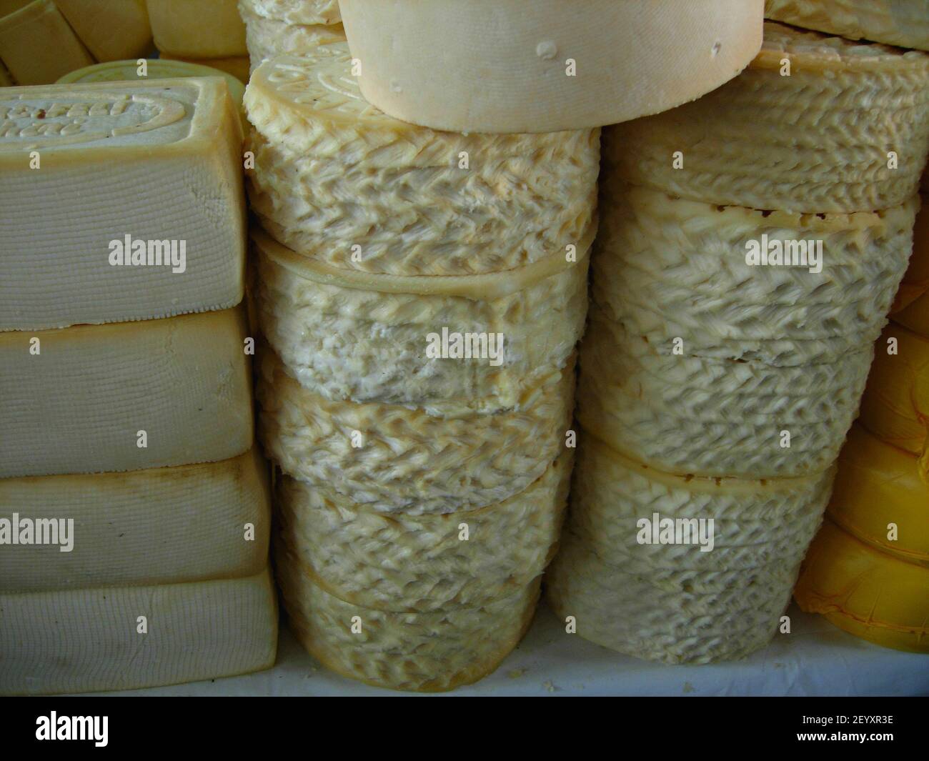 Rounds of homemade artisan Peruvian cheese as seen at the local Market ...