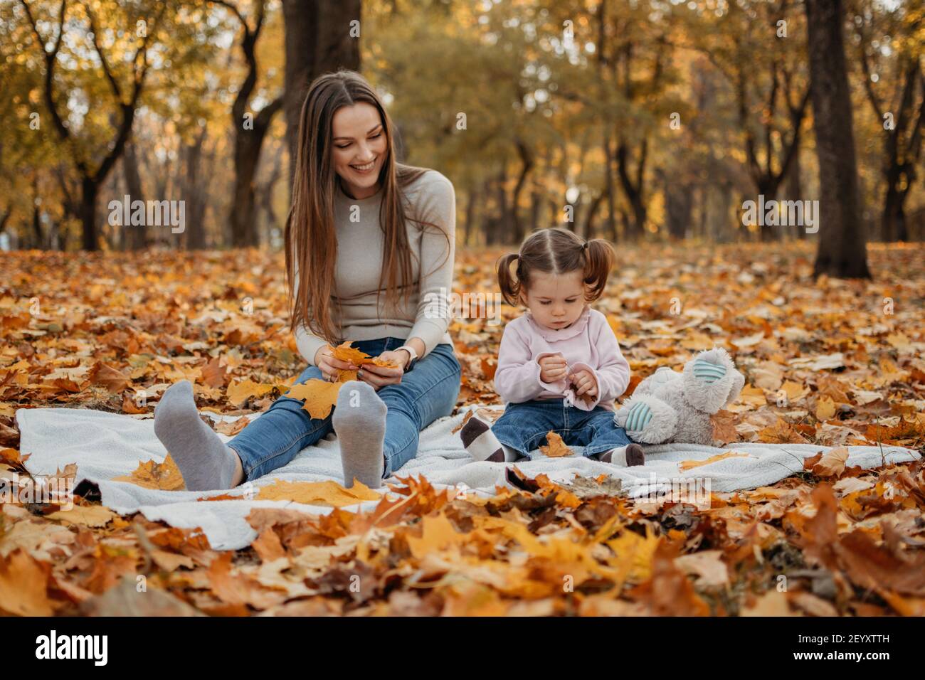 Family Playing Outside In Fall