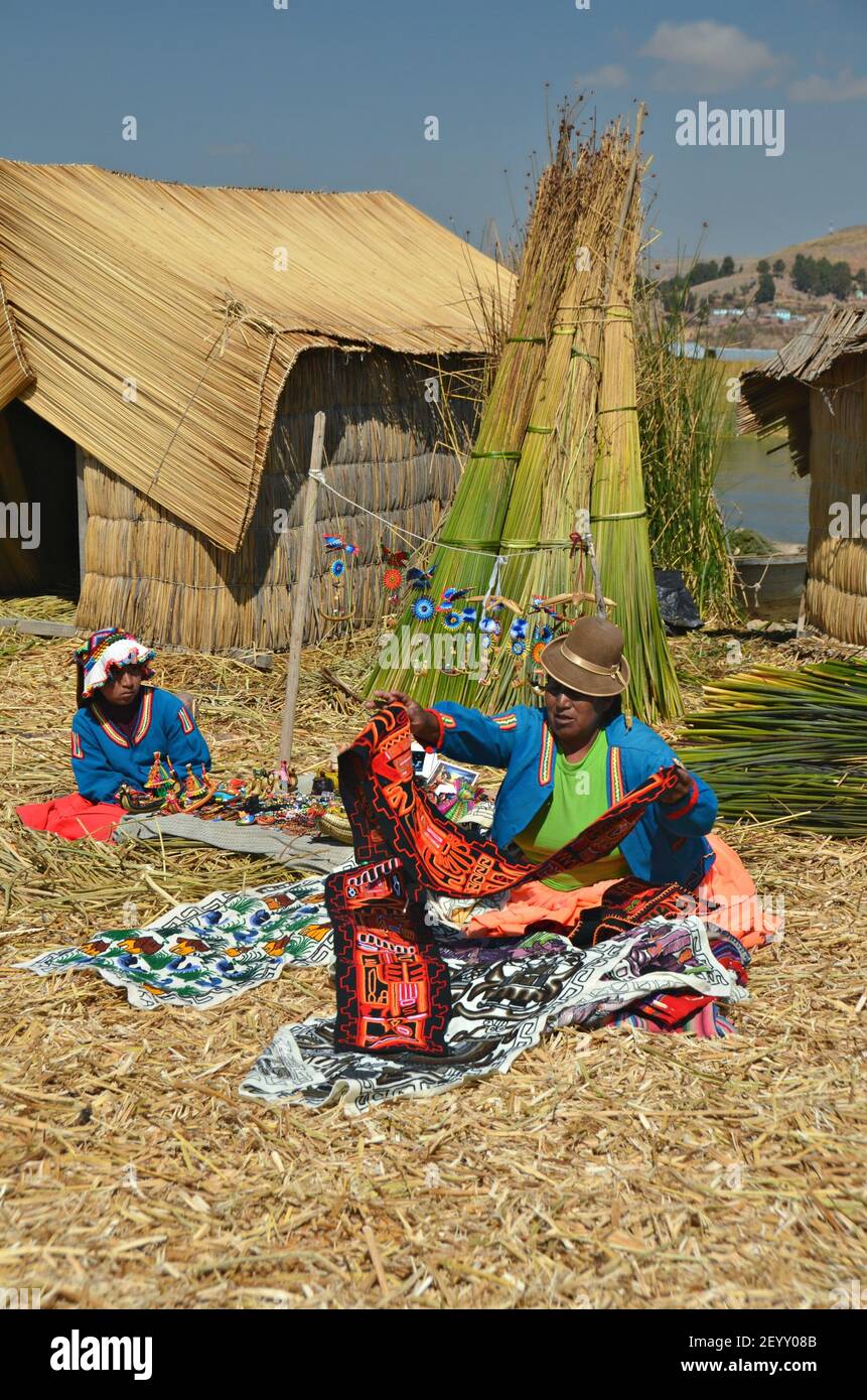 Indigenous Uru people on a self fashioned floating island selling their ...