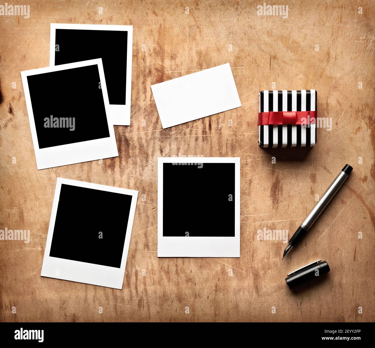 Blank photo frames with gift box and visit card Stock Photo - Alamy