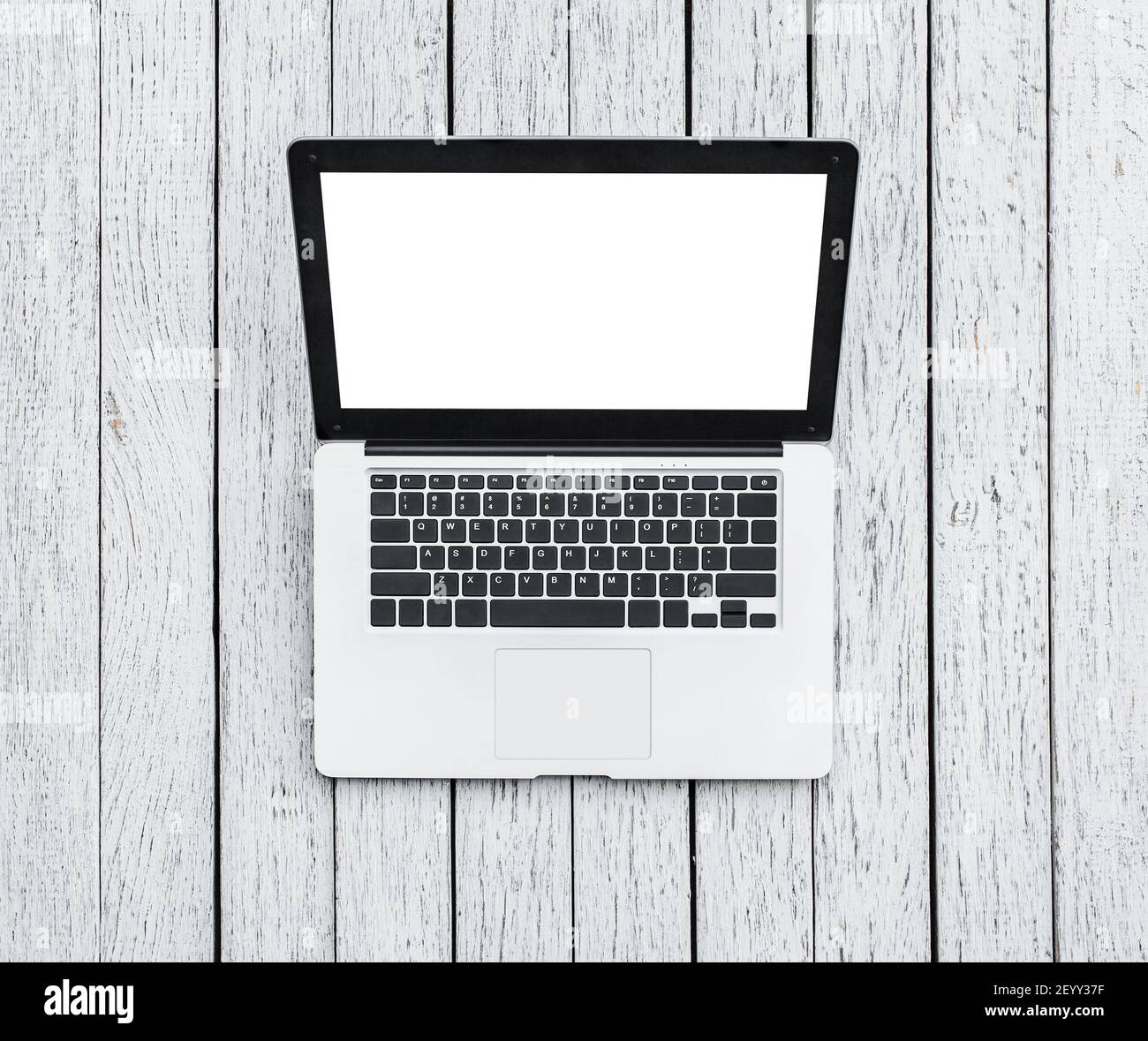 Open laptop with isolated screen on wooden desk Stock Photo - Alamy