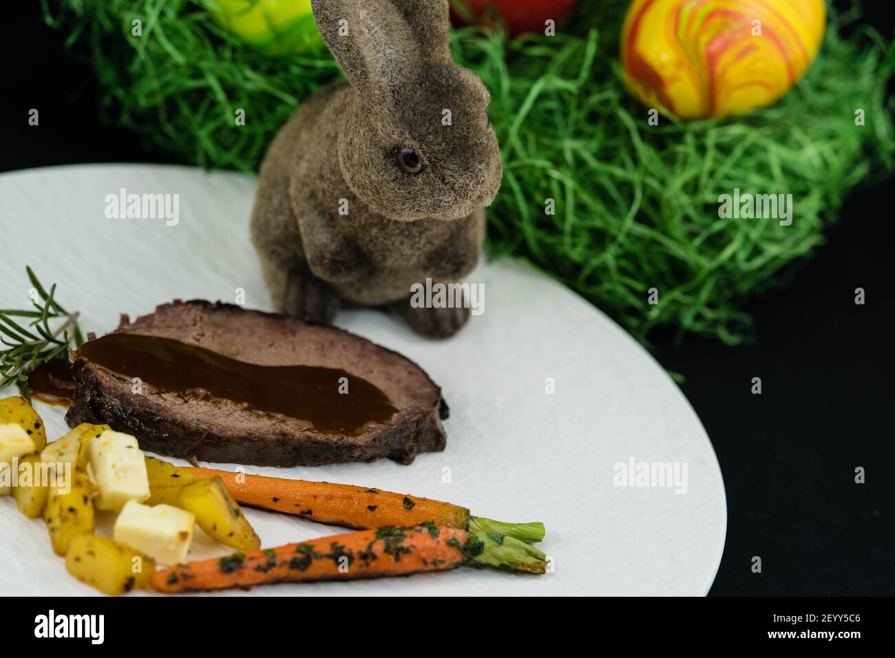 Easter roast beef shoulder with rosemary potatoes Stock Photo - Alamy