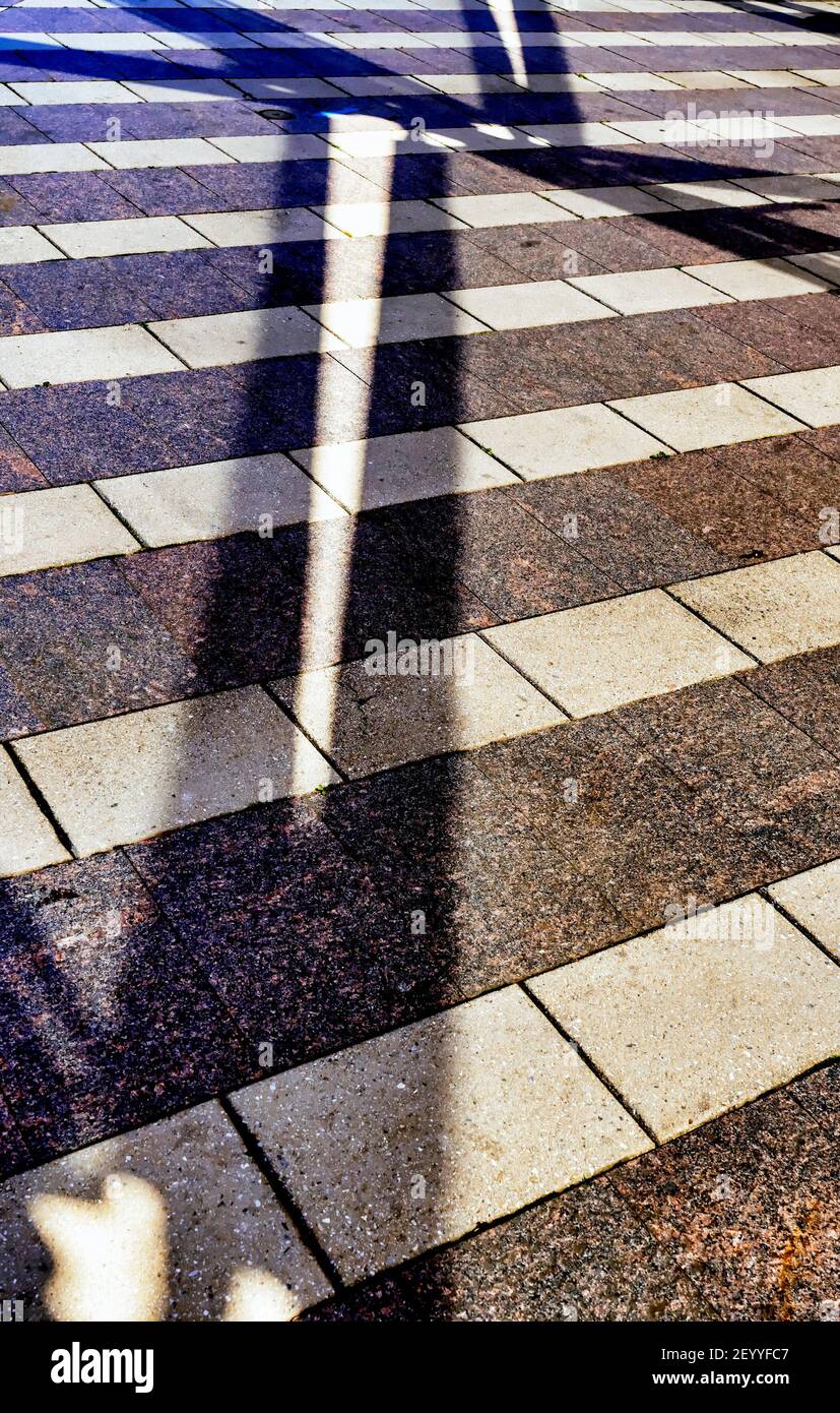 Shafts of light and shadows on a patio floor Stock Photo - Alamy