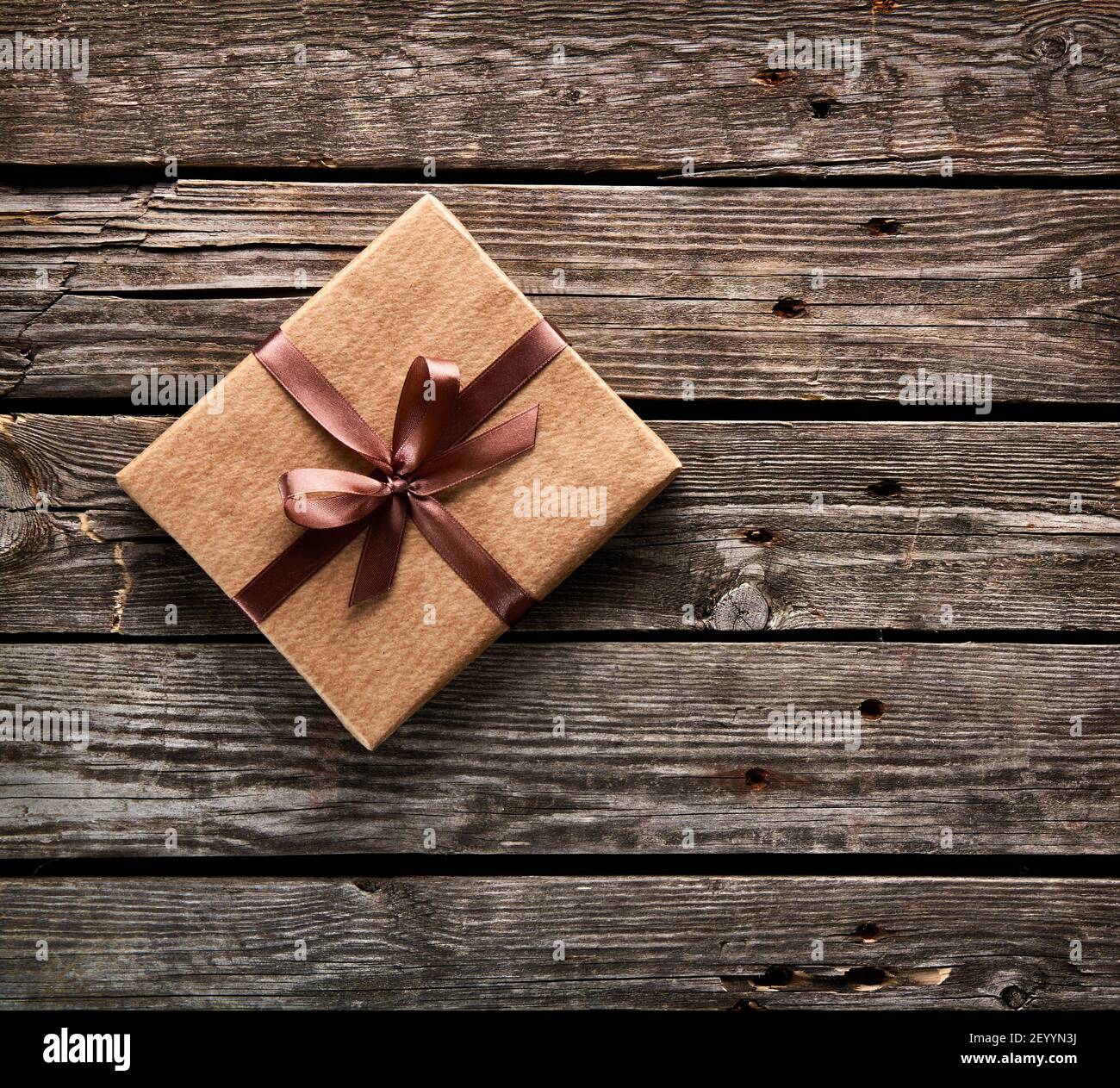 Vintage gift box on wooden background Stock Photo - Alamy