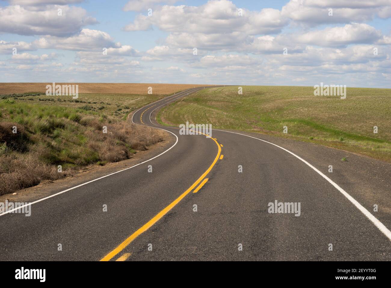 Paved Two Lane Road Highway Transportation White Clouds Blue Skky Stock ...