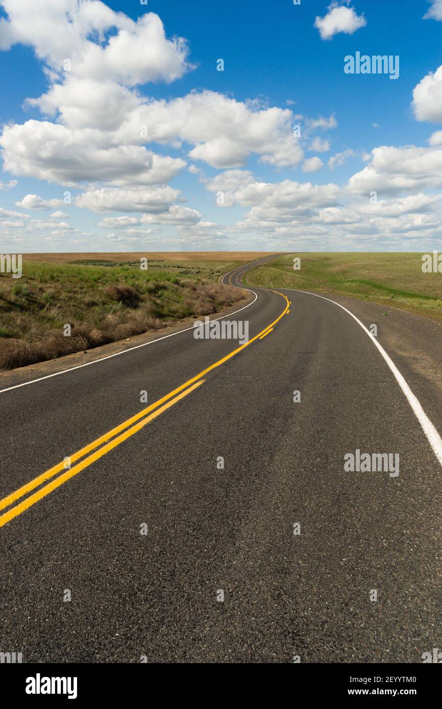 Paved Two Lane Road Highway Transportation White Clouds Blue Skky Stock ...