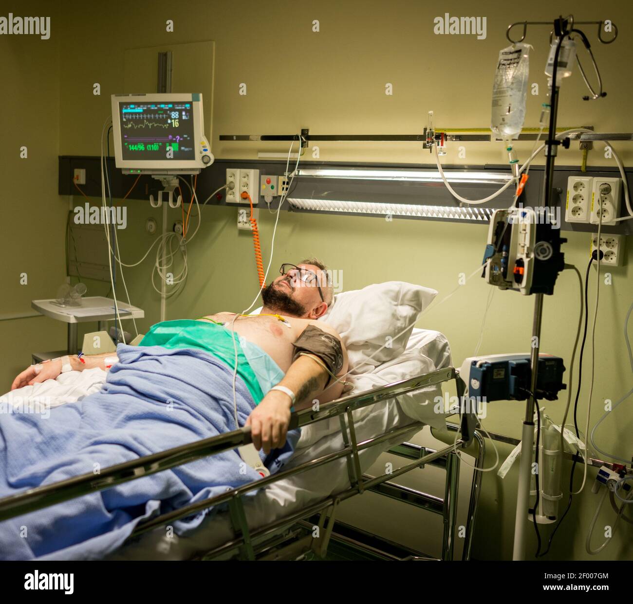 Man on hospital bed for recovery , high photo Stock Photo - Alamy