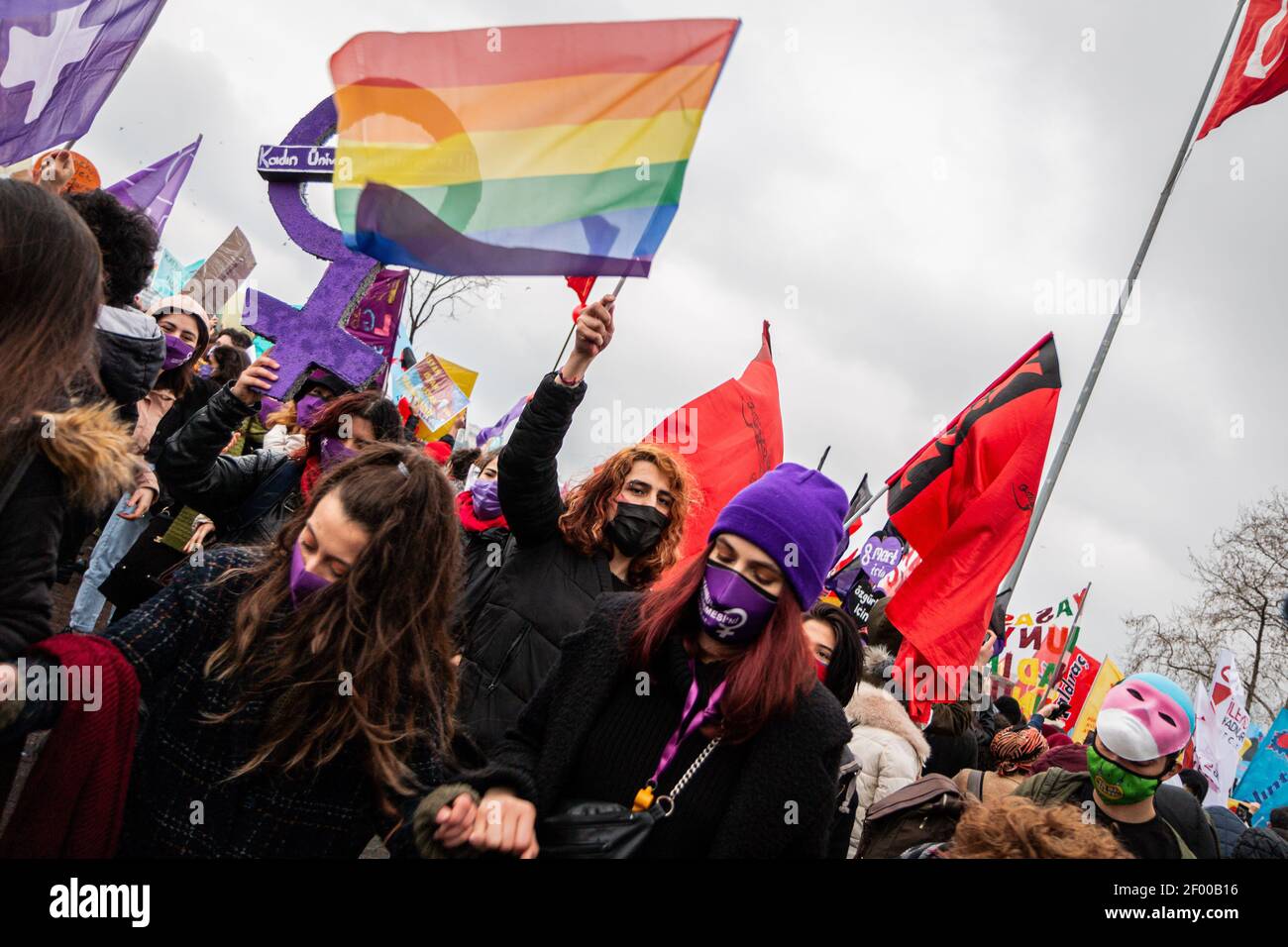 A protestor waves a LGBTI+ flag during the demonstration.Women of many ...
