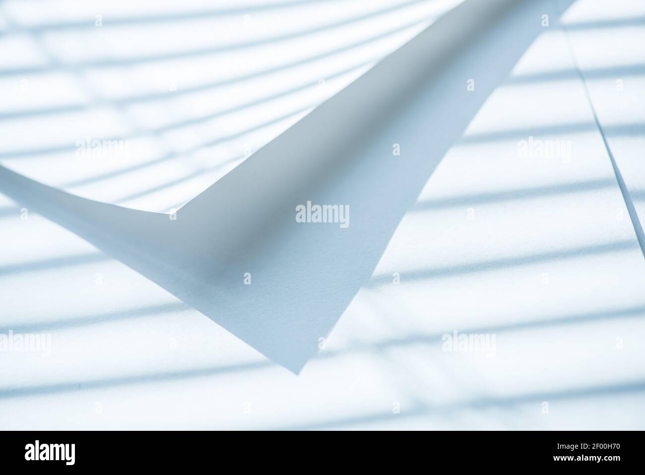 Paper sheets under shadow lines Stock Photo - Alamy