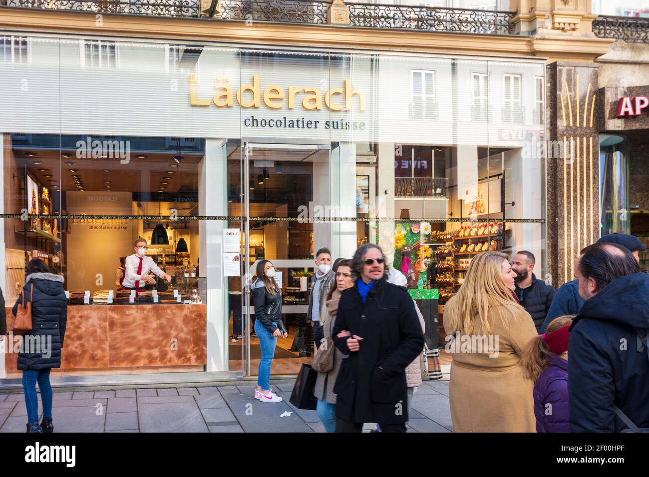 Wien, Vienna: people line up in front of chocolate shop due to COVID-19 ...