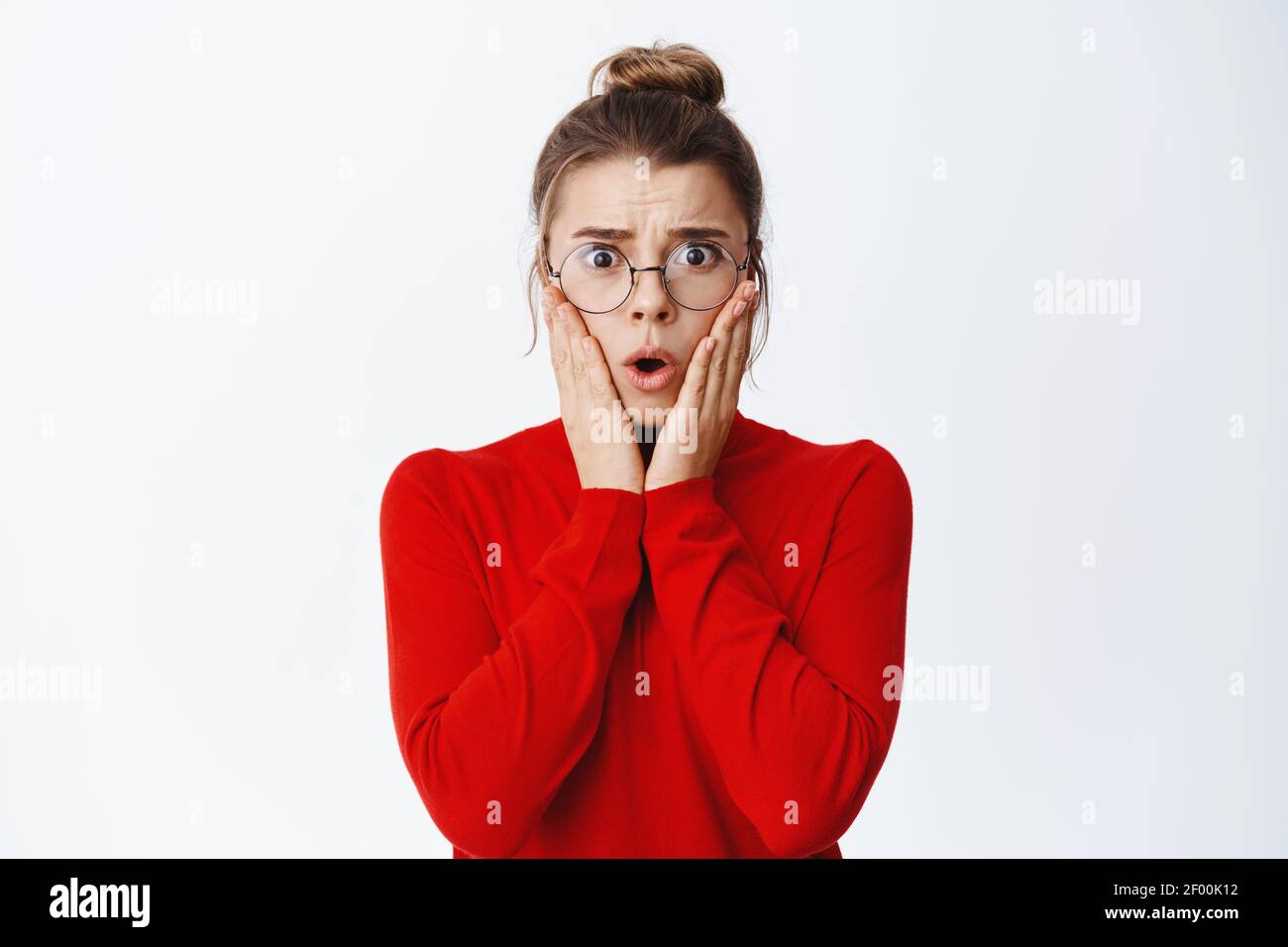 Shocked female CEO manager looking concerned and worried, holding hands ...