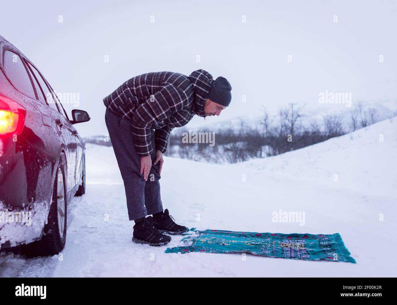 Muslim traveler praying in winter mountain , high quality Stock Photo ...