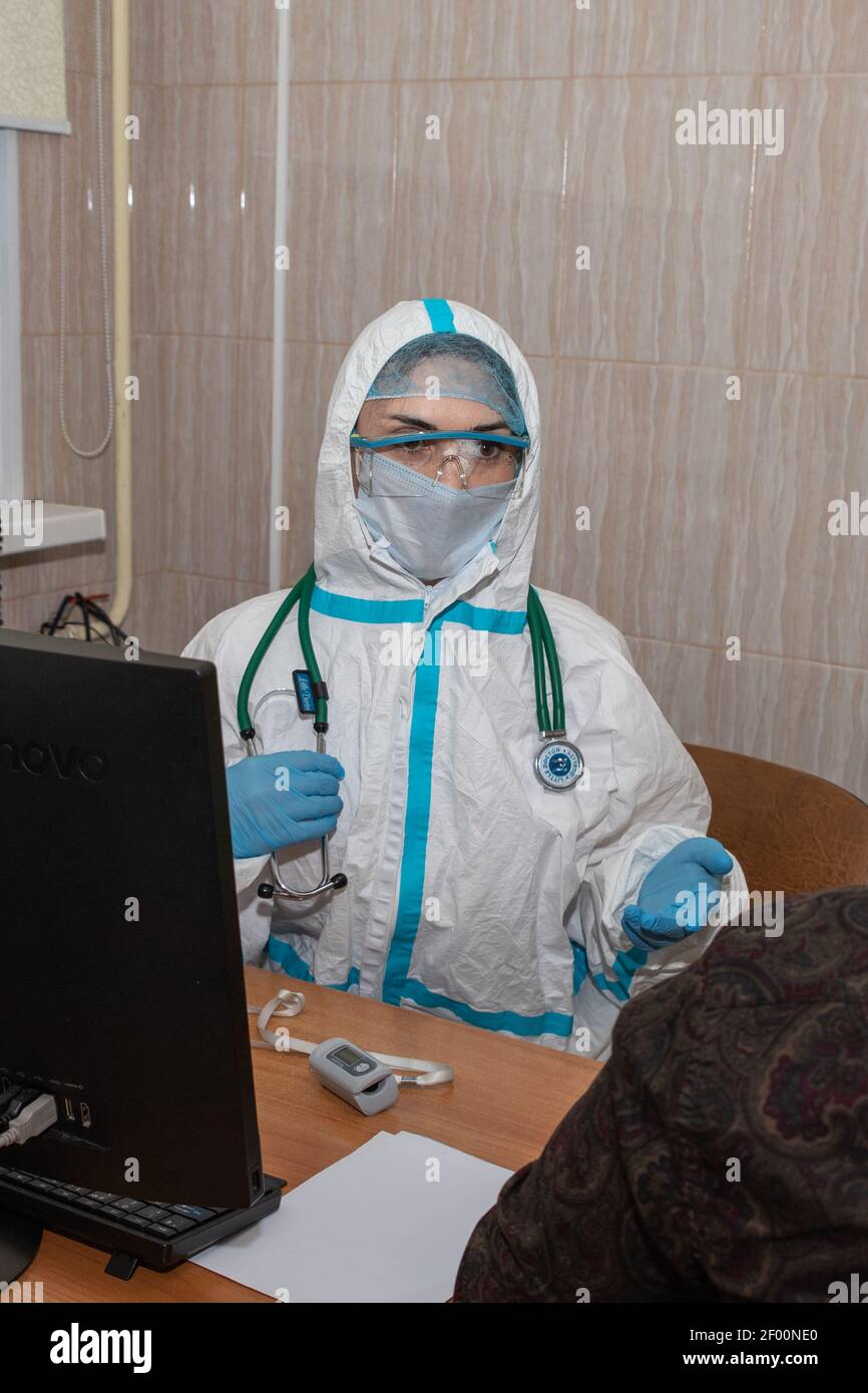 Doctor wearing protection Suit for Fighting Covid-19 in clinic, medical ...
