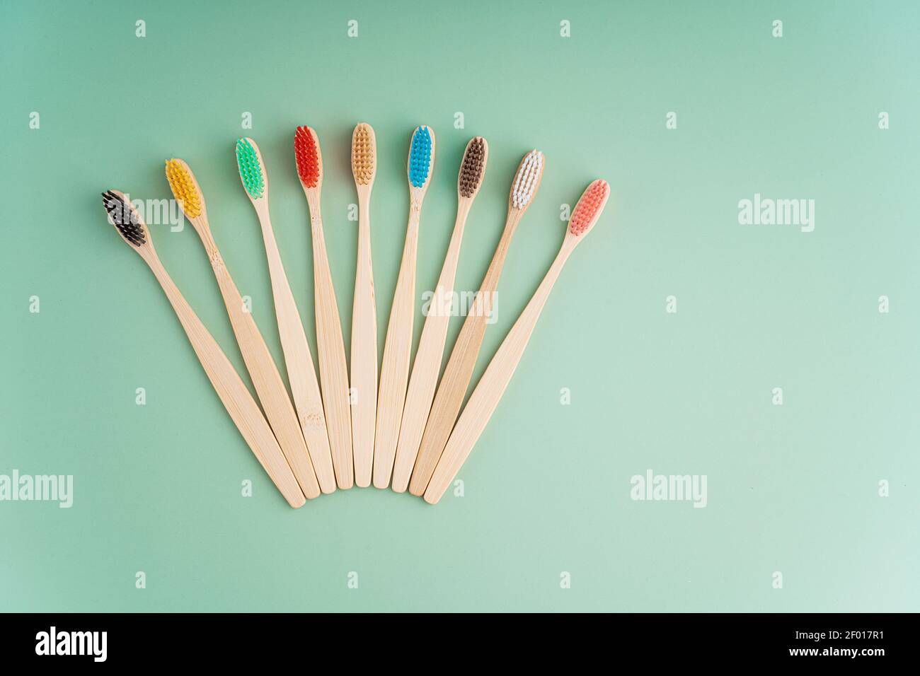 A set of Eco-friendly antibacterial toothbrushes made of bamboo wood on ...