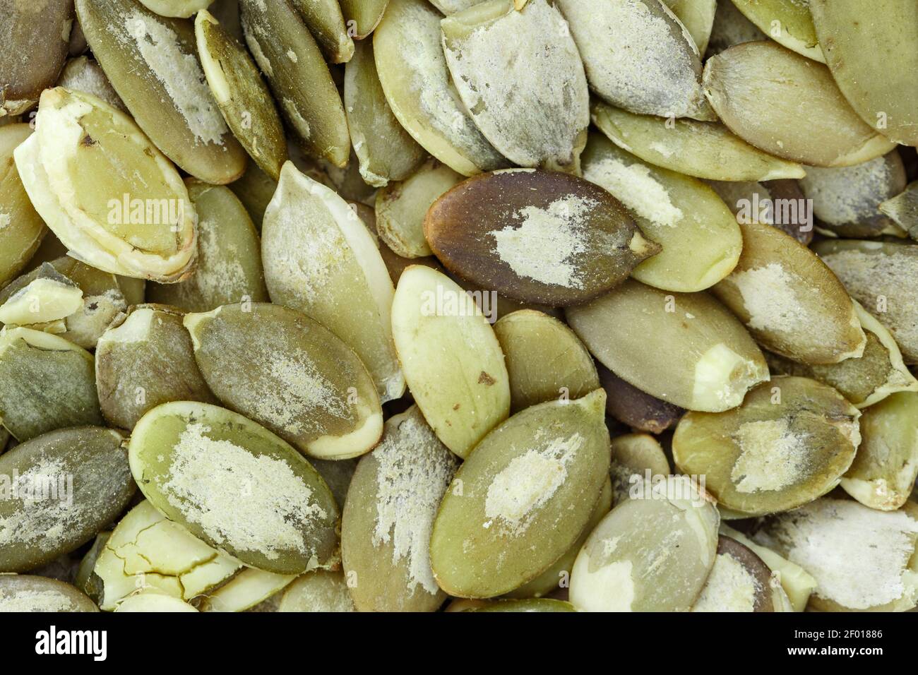 Close-up background texture of green pumpkin seeds. Top view Stock ...