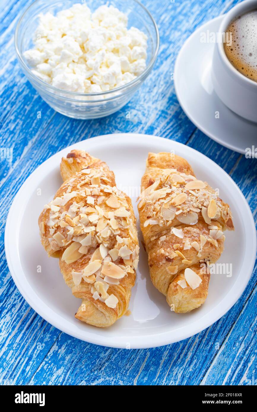 Morning breakfast. Fresh French croissant with coffee and cottage ...