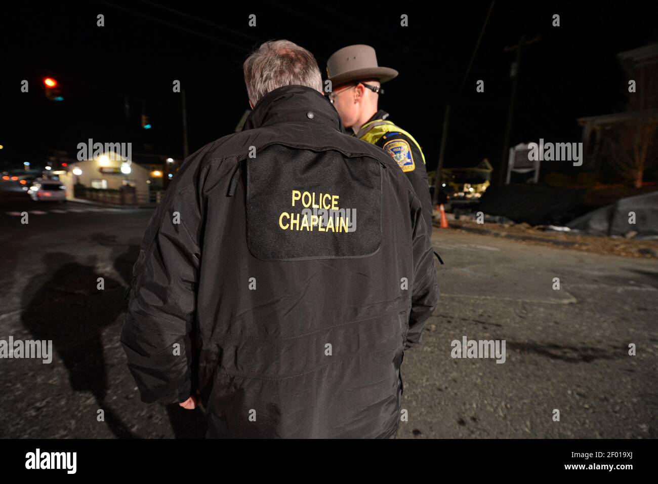 14 DECEMBER 2012 - Newtown - A Police Chaplin talks with a Connecticut ...
