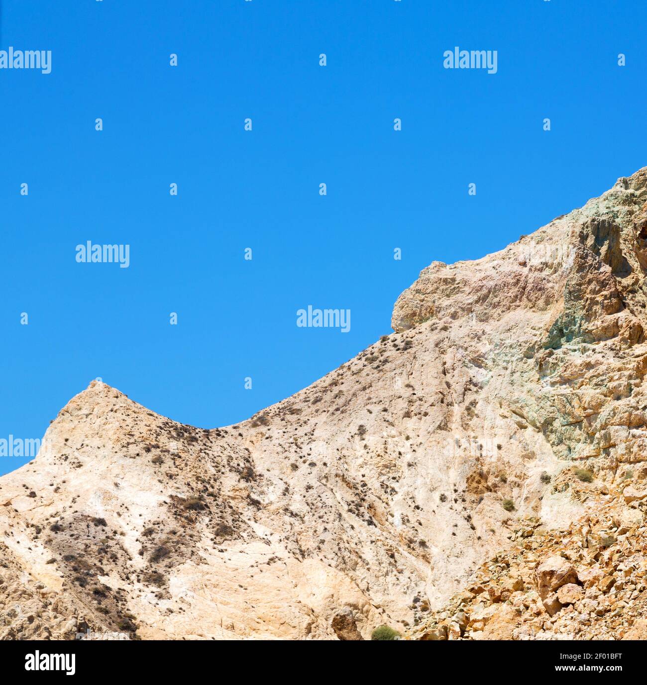 Rock alone in the sky santorini europe greece and dry bush Stock Photo ...
