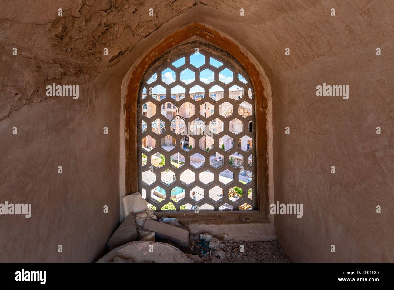 Wooden window with hexagonal latice leading to a bazaar crossroads in ...