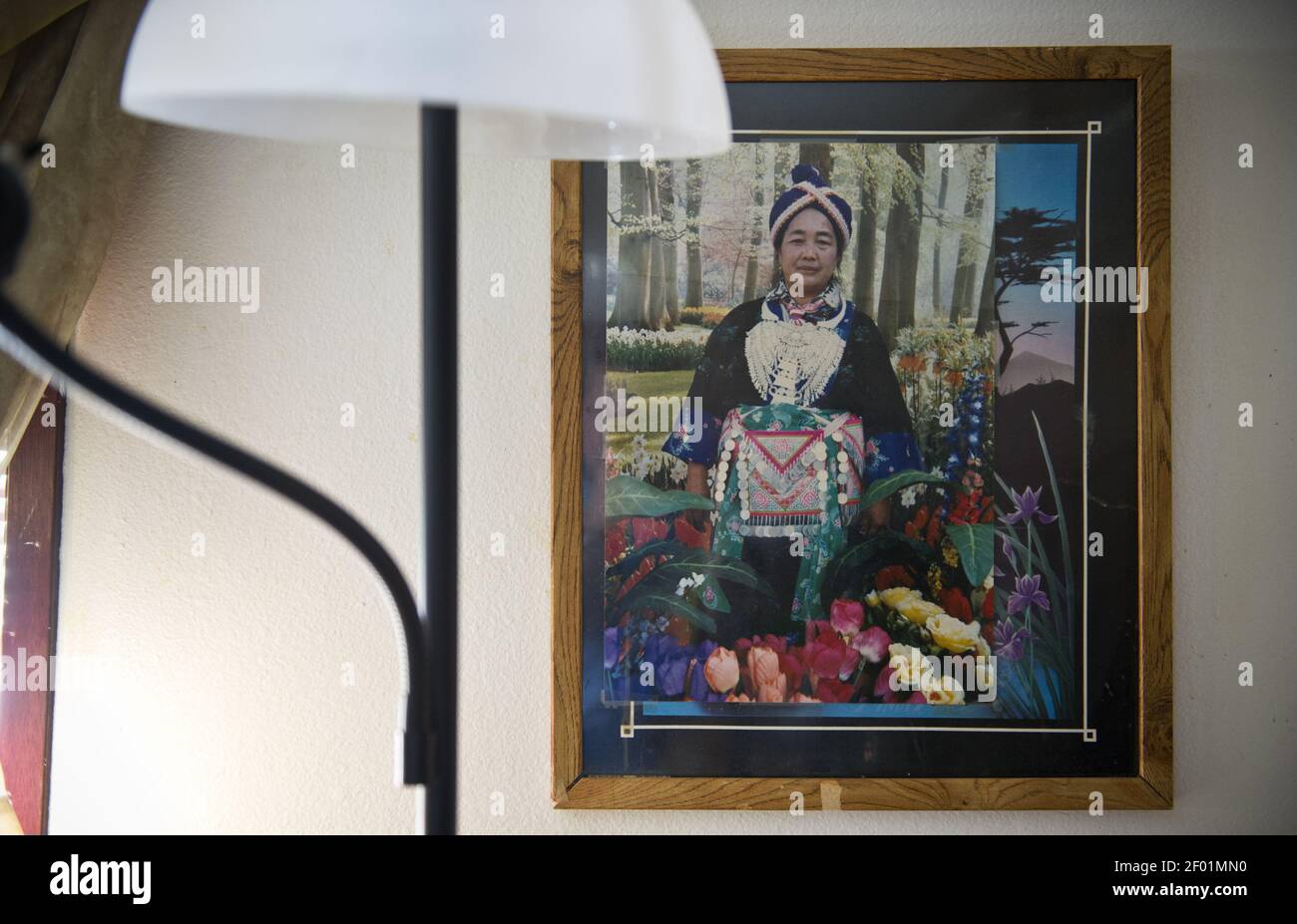 A photo of Steve Vue's grandmother, Sei, hangs in the family home ...