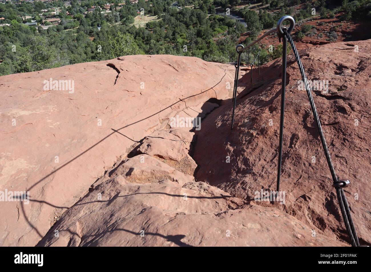 The hiking path with handrail through red rocks in Sedona, Arizona ...