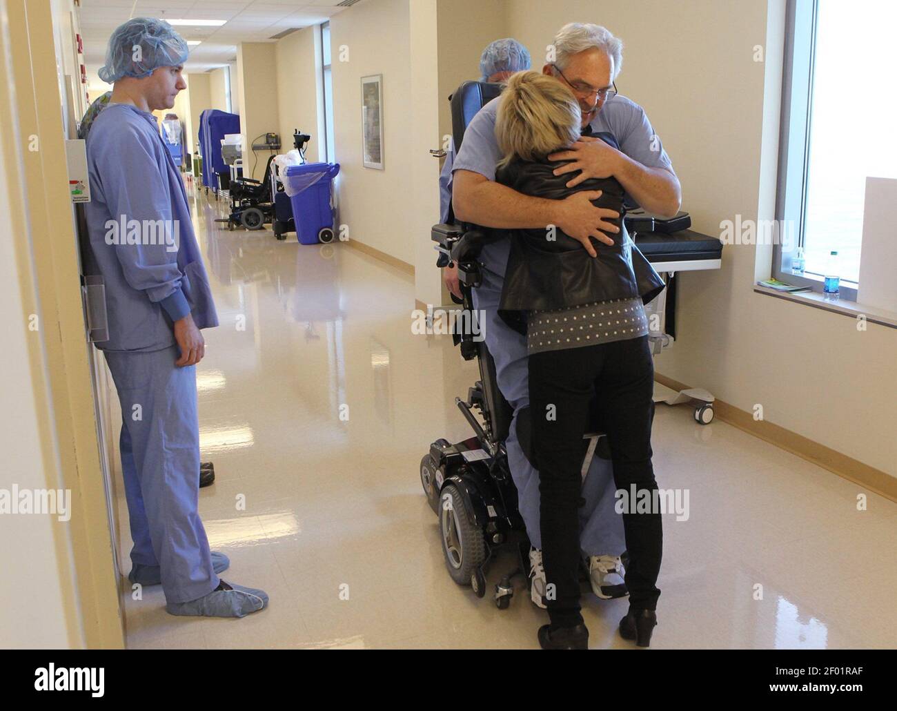 In this December 2012 photograph, Luke Moore (left), from Provider Plus ...