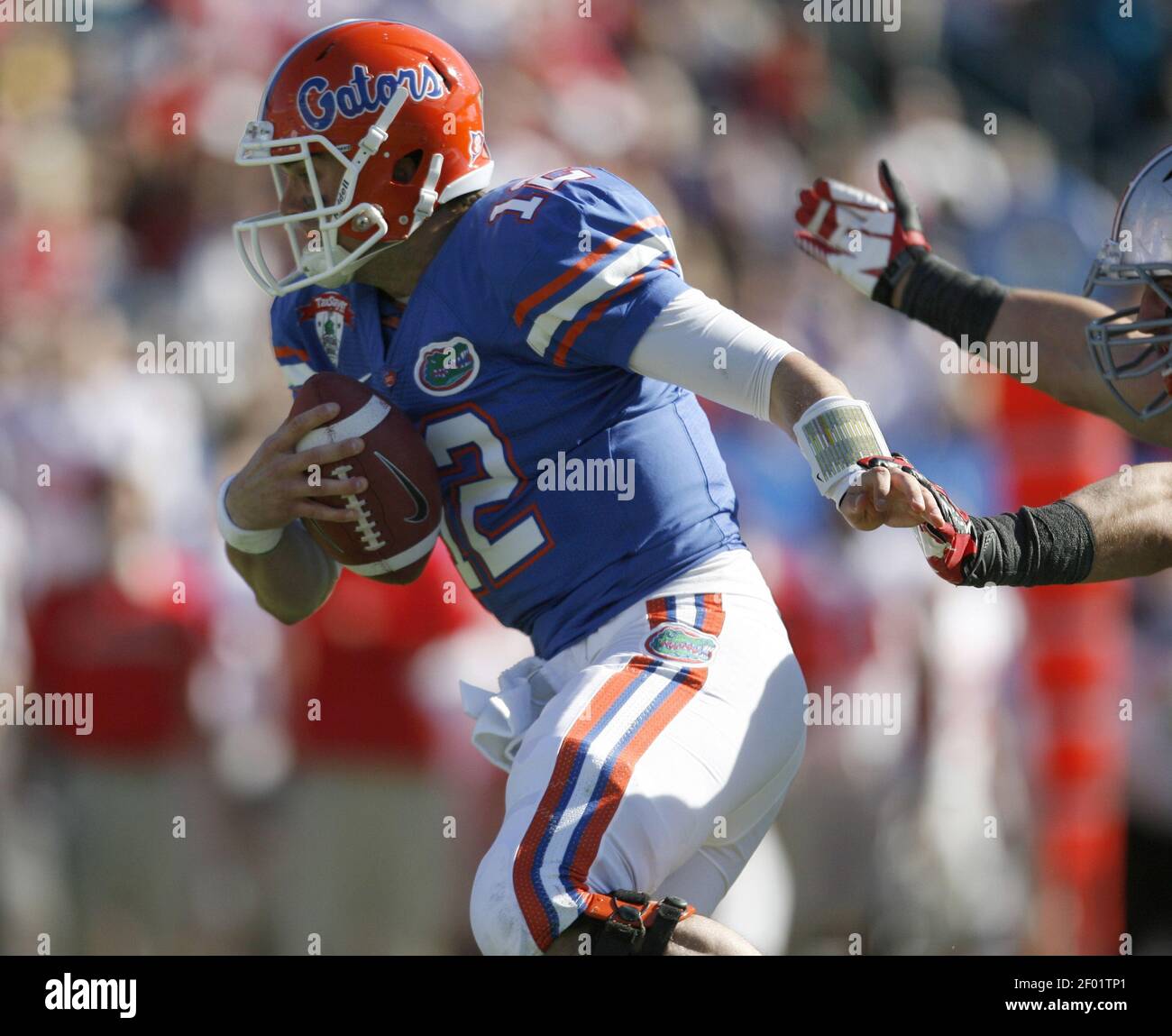 Florida quarterback John Brantley (12) scrambles under pressure from ...